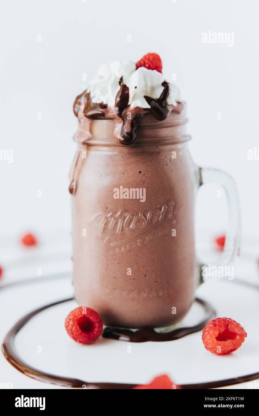 A closeup shot of an appetizing raspberry chocolate milkshake Stock ...