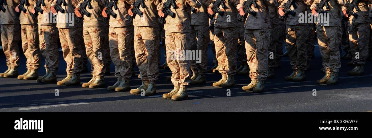 Soldiers standing in row in camouflage uniforms Stock Photo - Alamy