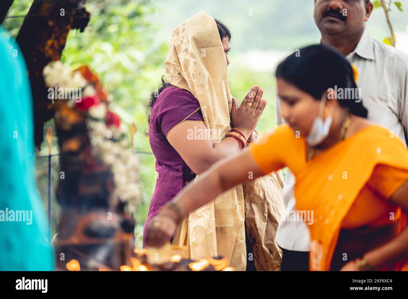 The women praying to idols and guards at the Narasimha Hindu temple in ...