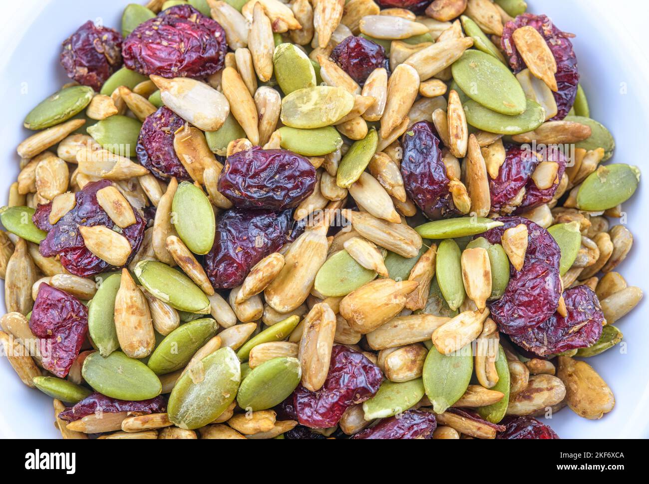 Salad topping with dried cranberries, pumpkin and sunflower seeds Stock ...