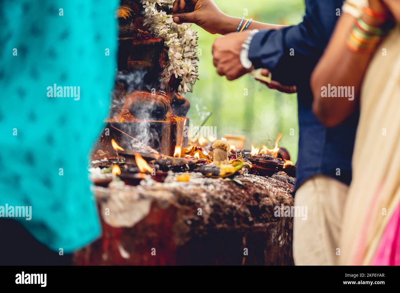 The hindu worshipers burning incense, and offering sacrifices to a ...