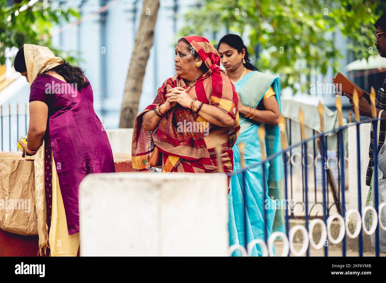 The women praying to idols and guards at the Narasimha Hindu temple in ...