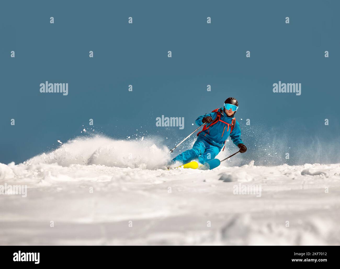 Fast skier rides downhill at ski resort. Offpiste freeride concept ...