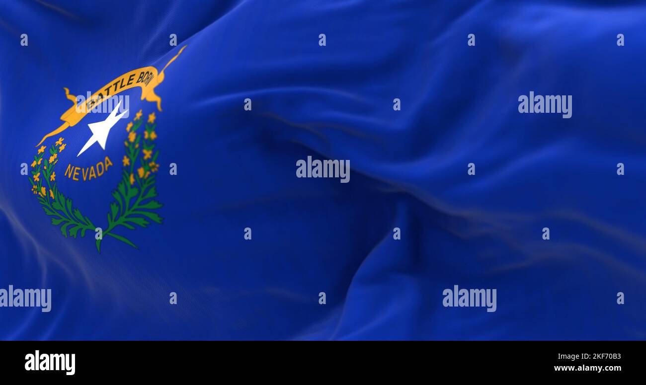 The Nevada state flag waving in the wind on a clear day. Nevada is a ...