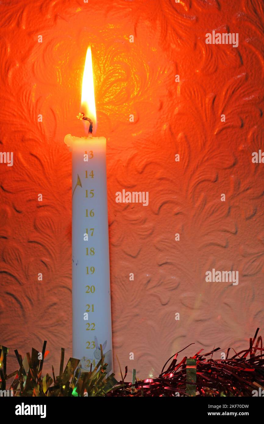Advent candle burning down and counting days to Christmas Stock Photo - Alamy