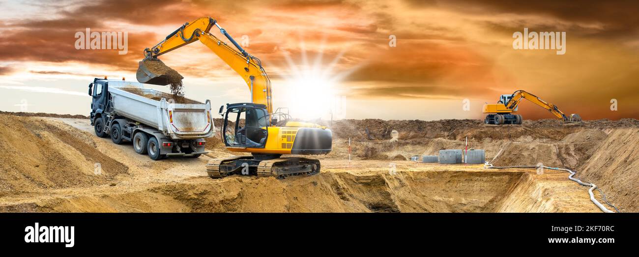 excavator is digging and loading at construction site Stock Photo - Alamy