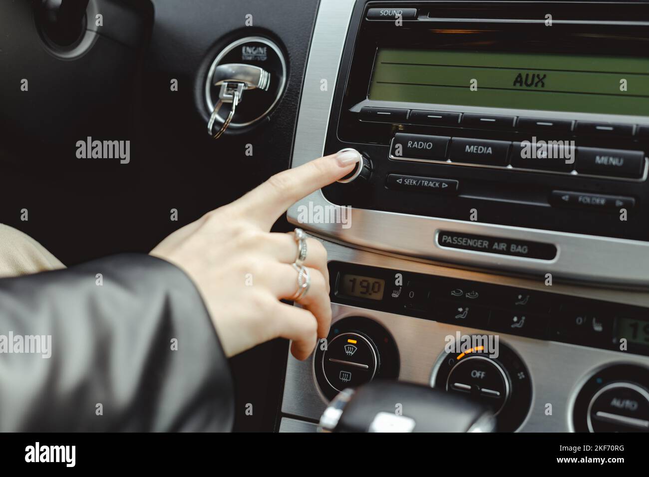 Car radio female hand hi-res stock photography and images - Alamy