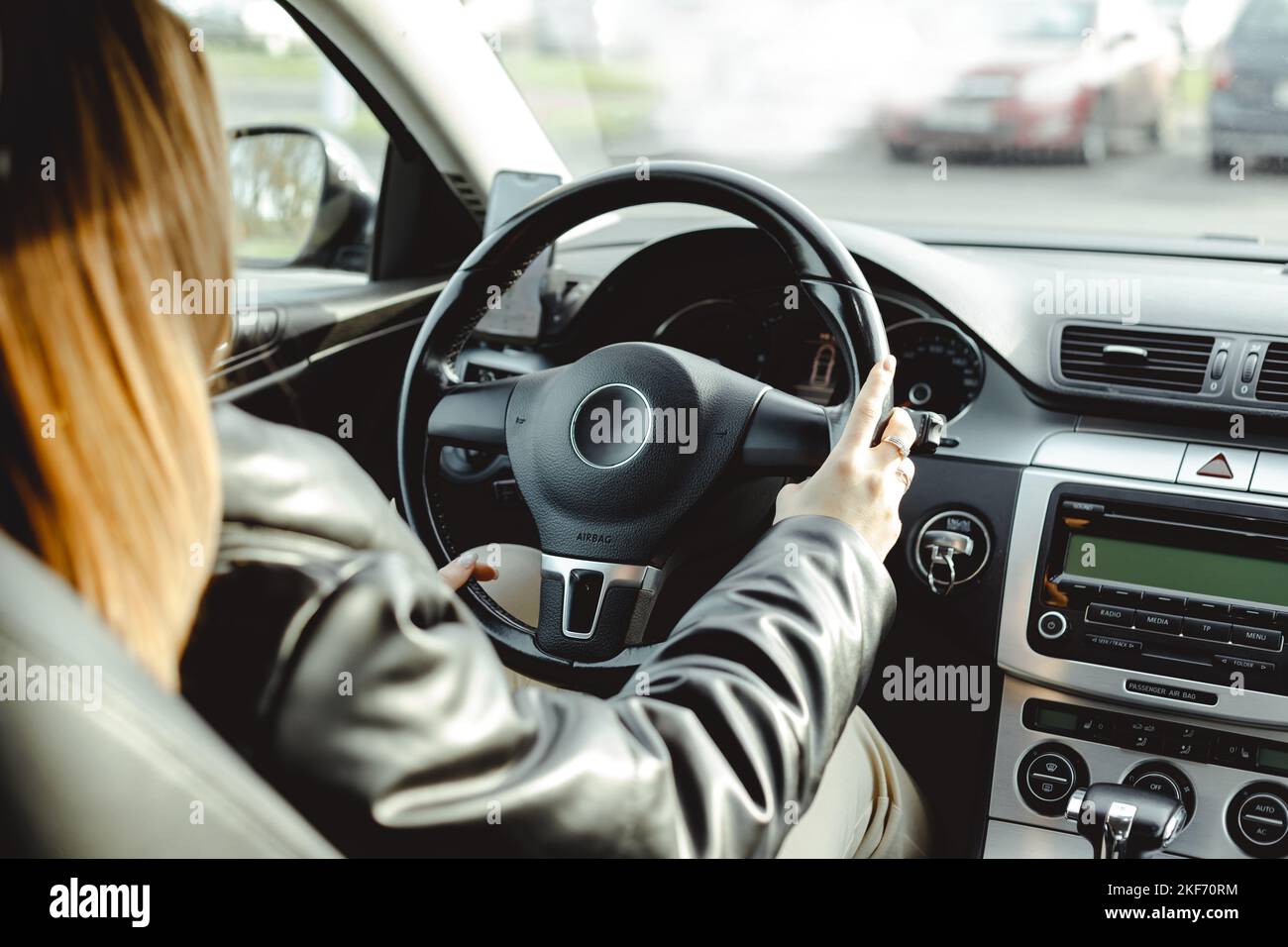Back view of an attractive woman while driving a car Stock Photo - Alamy