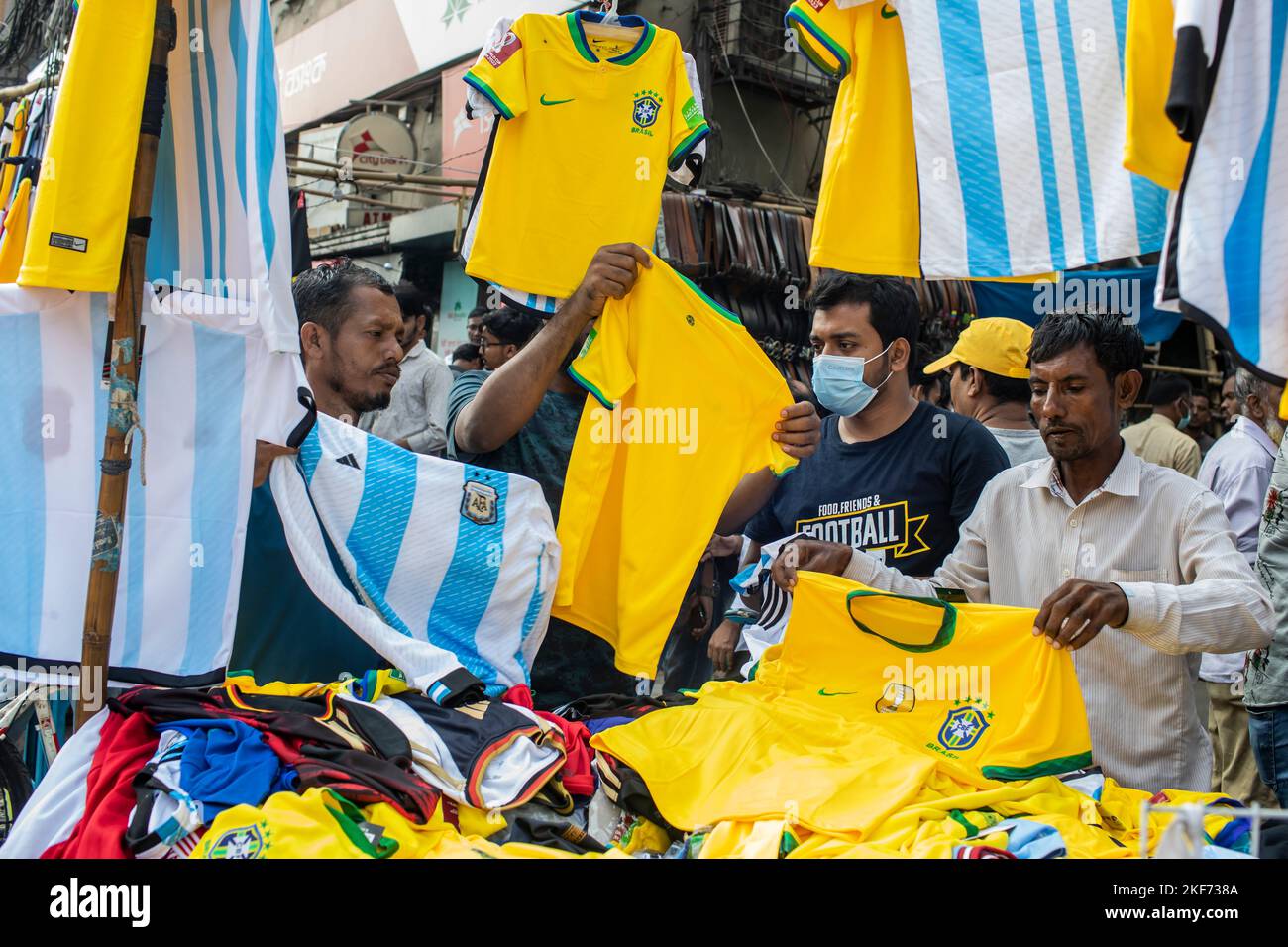 Bangladeshi vendors sell Brazil and Argentina jersey ahead of FIFA world cup 2022. (Photo by ...