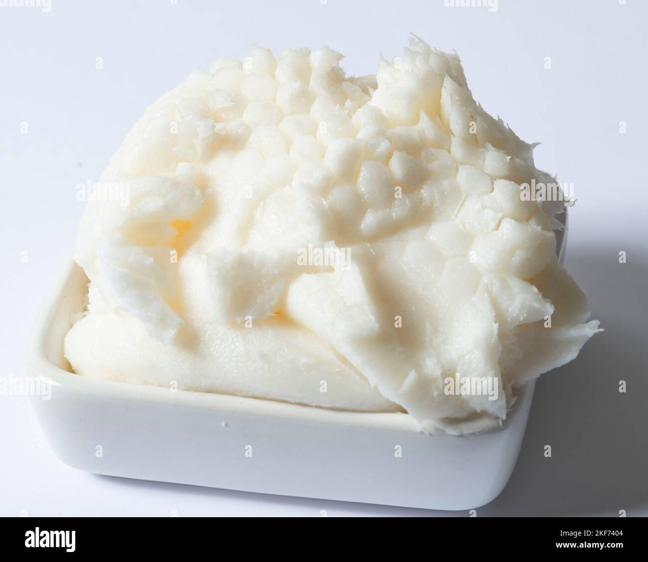 Small plate of lard on white background Stock Photo - Alamy