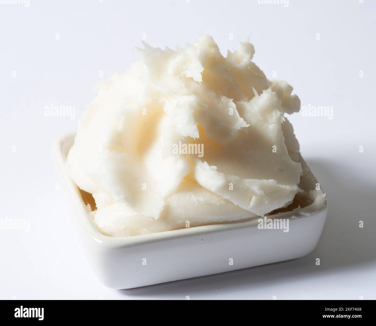 Small plate of lard on white background Stock Photo - Alamy