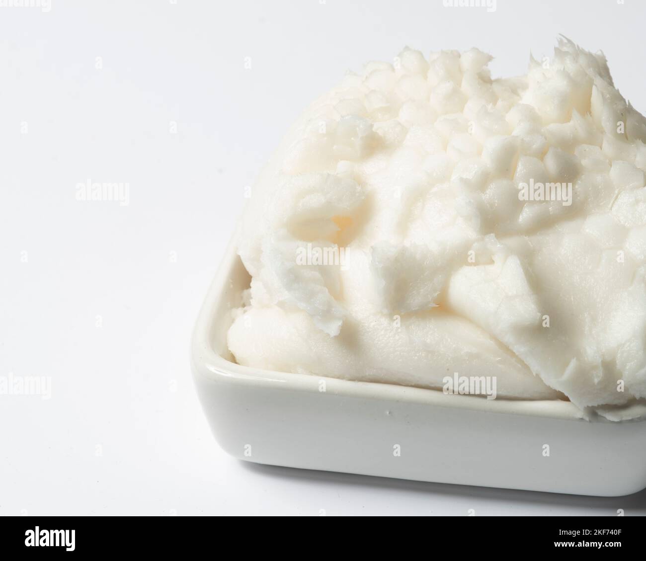 Small plate of lard on white background Stock Photo - Alamy