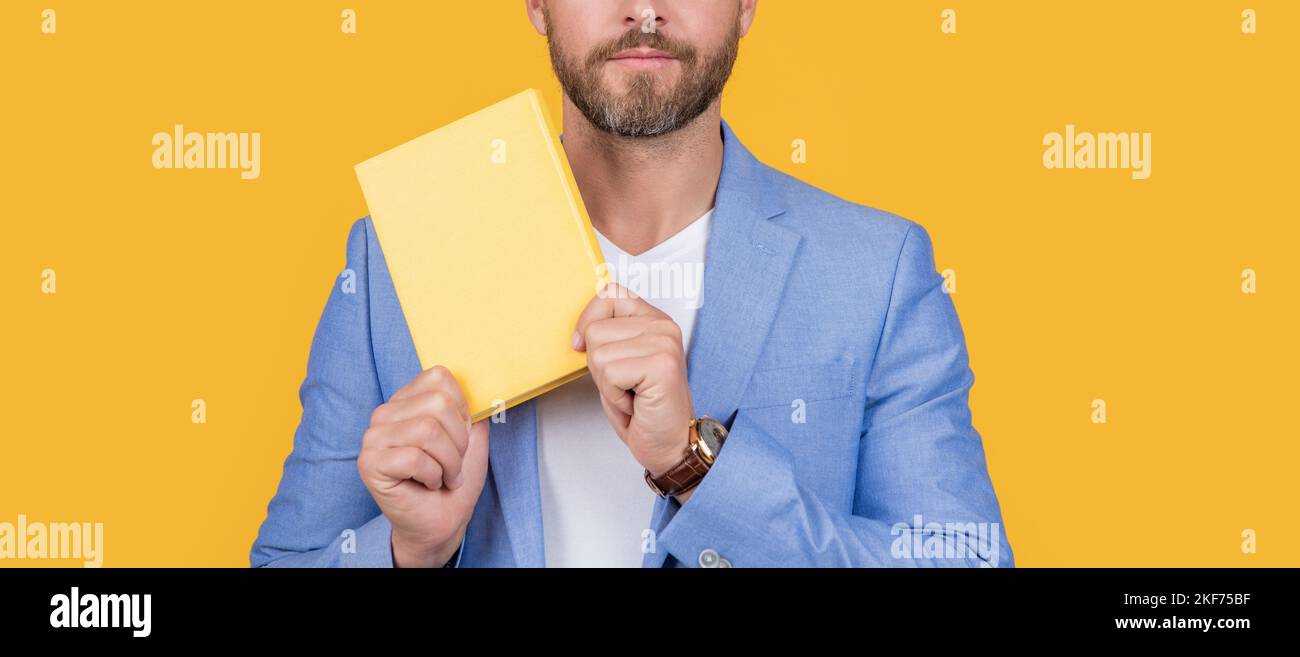 studio shot of guy holding agenda. cropped view of guy hold agenda. guy ...