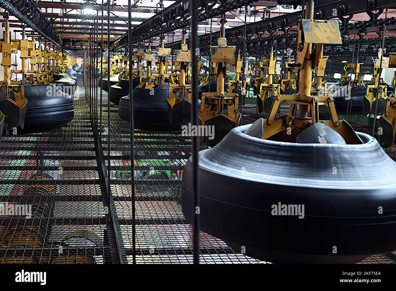Tire manufacturing plant. Tyre production machine coveyor Stock Photo - Alamy