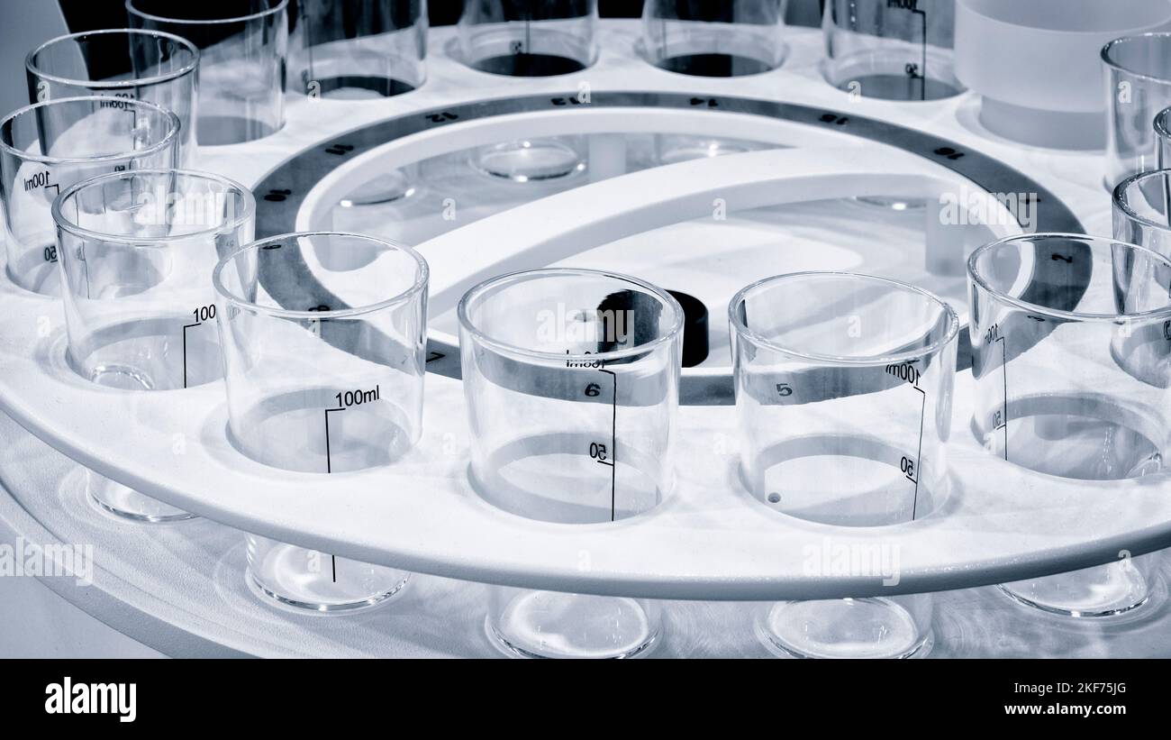 Medical or chemical background with laboratory equipment and liquids ...