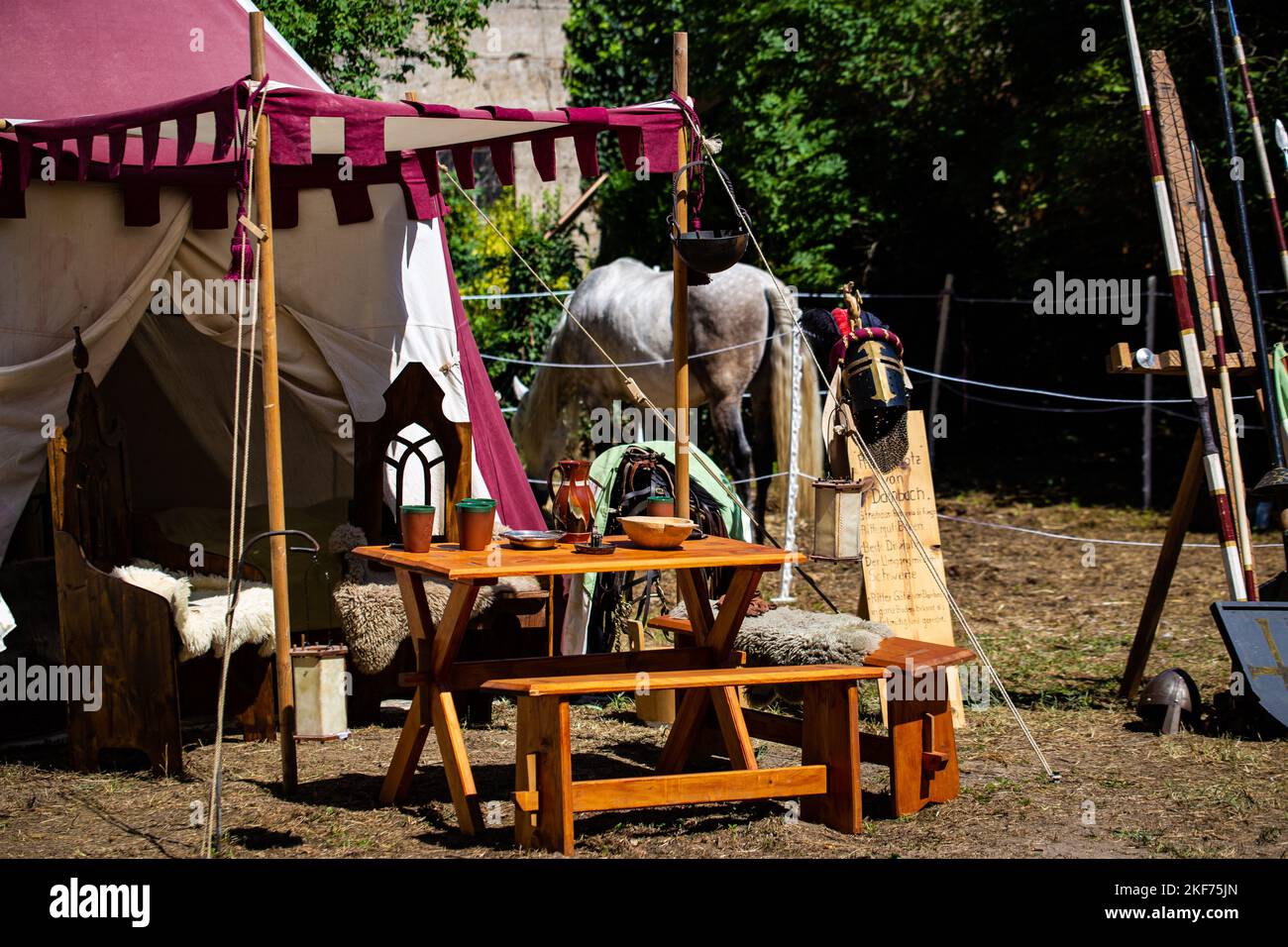 A Medieval encampment with a table and a horse outdoors Stock Photo - Alamy