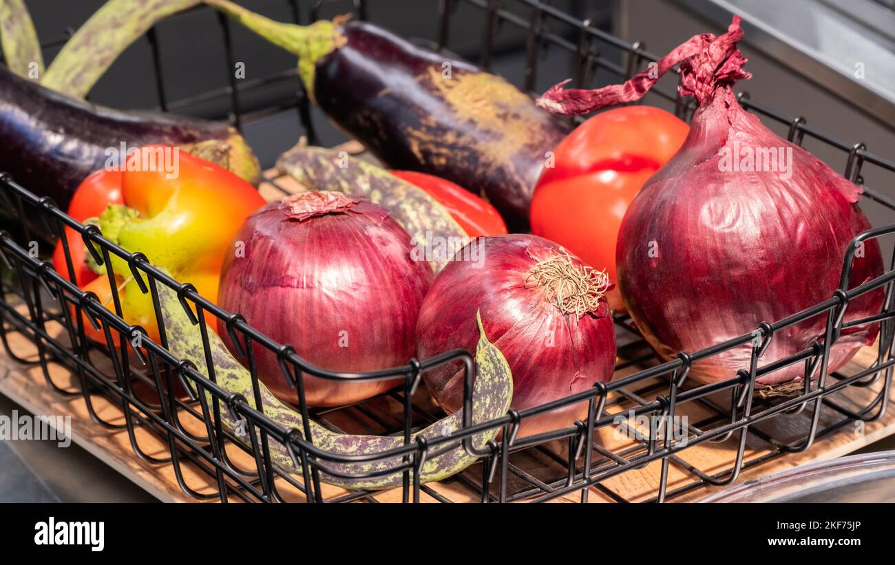 Closeup on table with vegetables in kitchen Stock Photo - Alamy