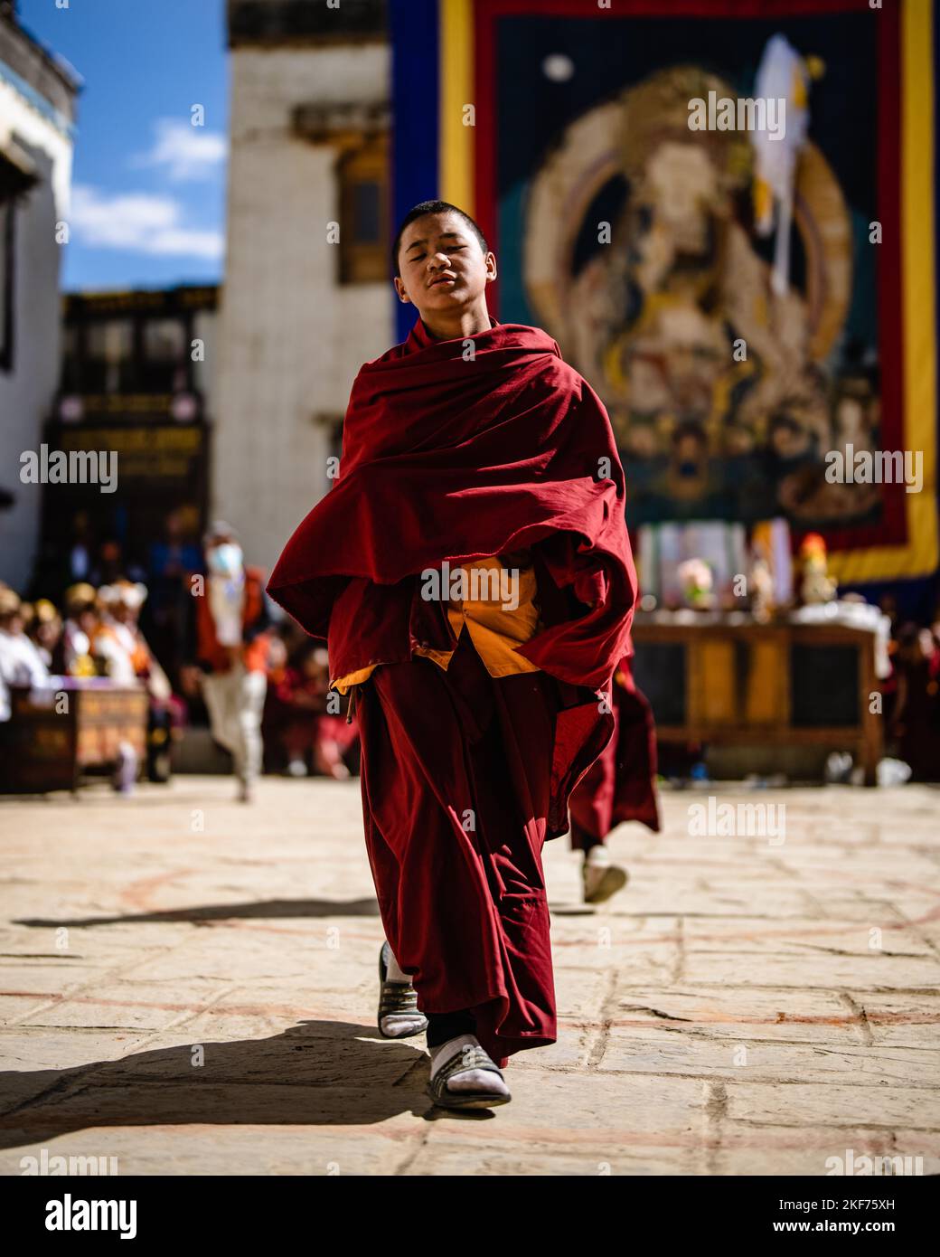 A young Tibetan Buddhist Monk at the ancient Tiji Festival in walled ...
