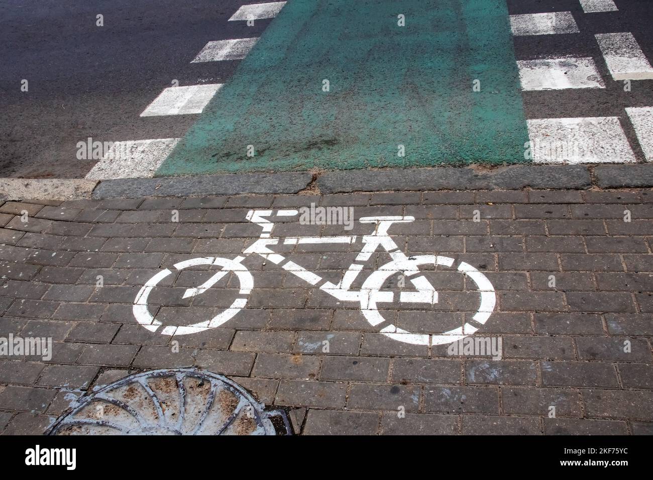 Bicycle path sign on paving slabs close up Stock Photo - Alamy