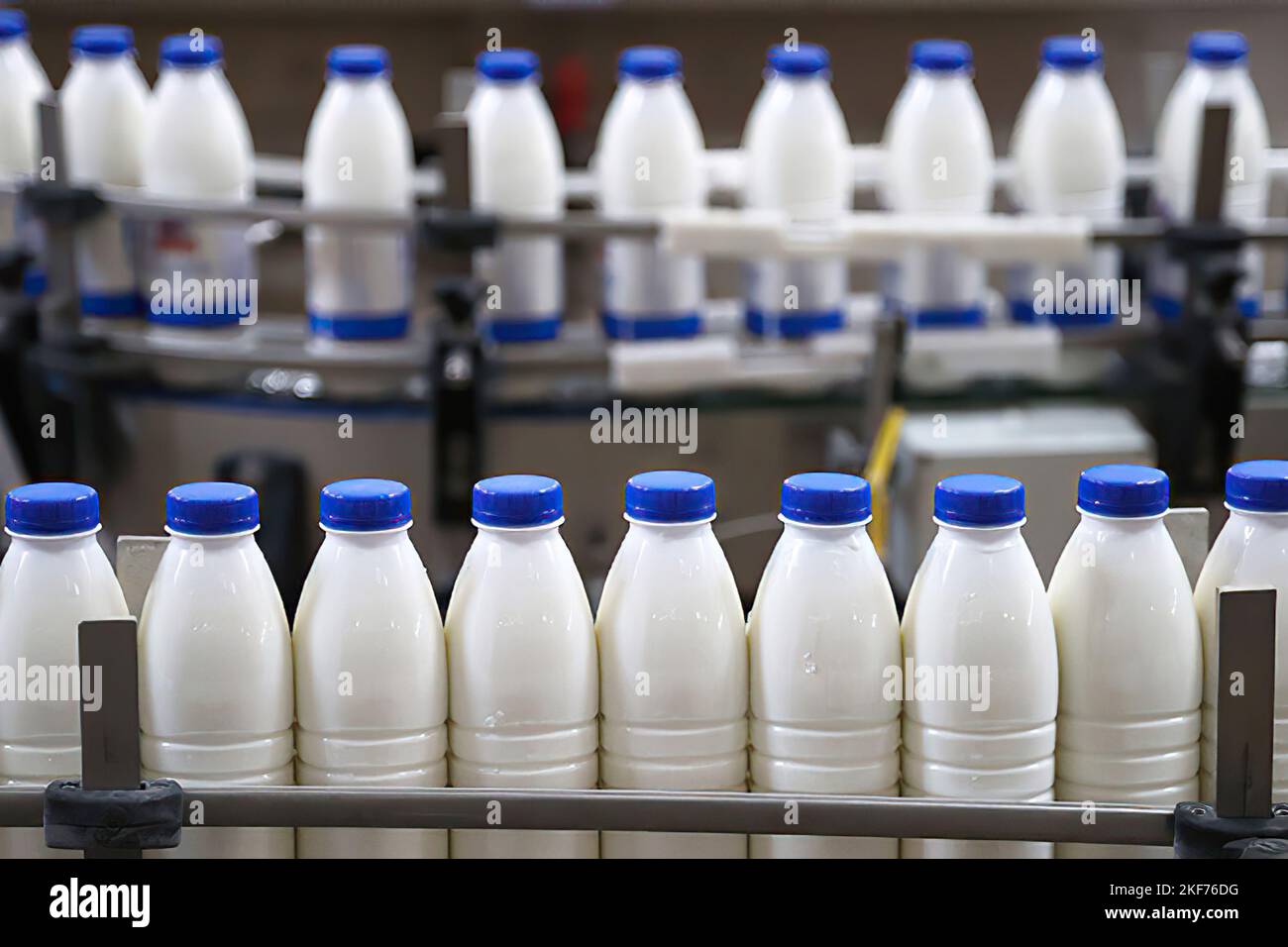 Dairy factory. Milk line production Stock Photo - Alamy