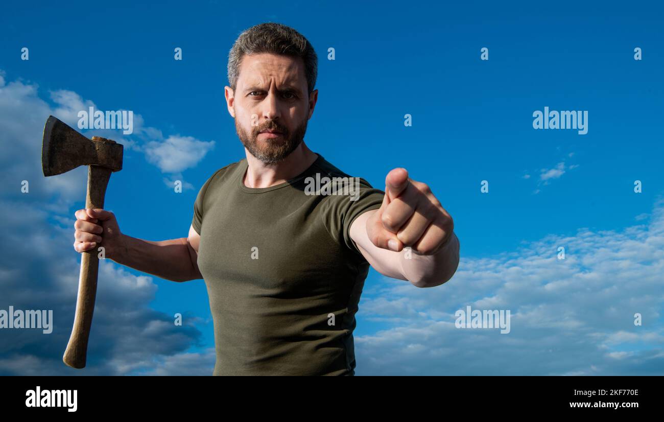 man threaten with axe. caucasian man hold ax. brutal man on sky ...
