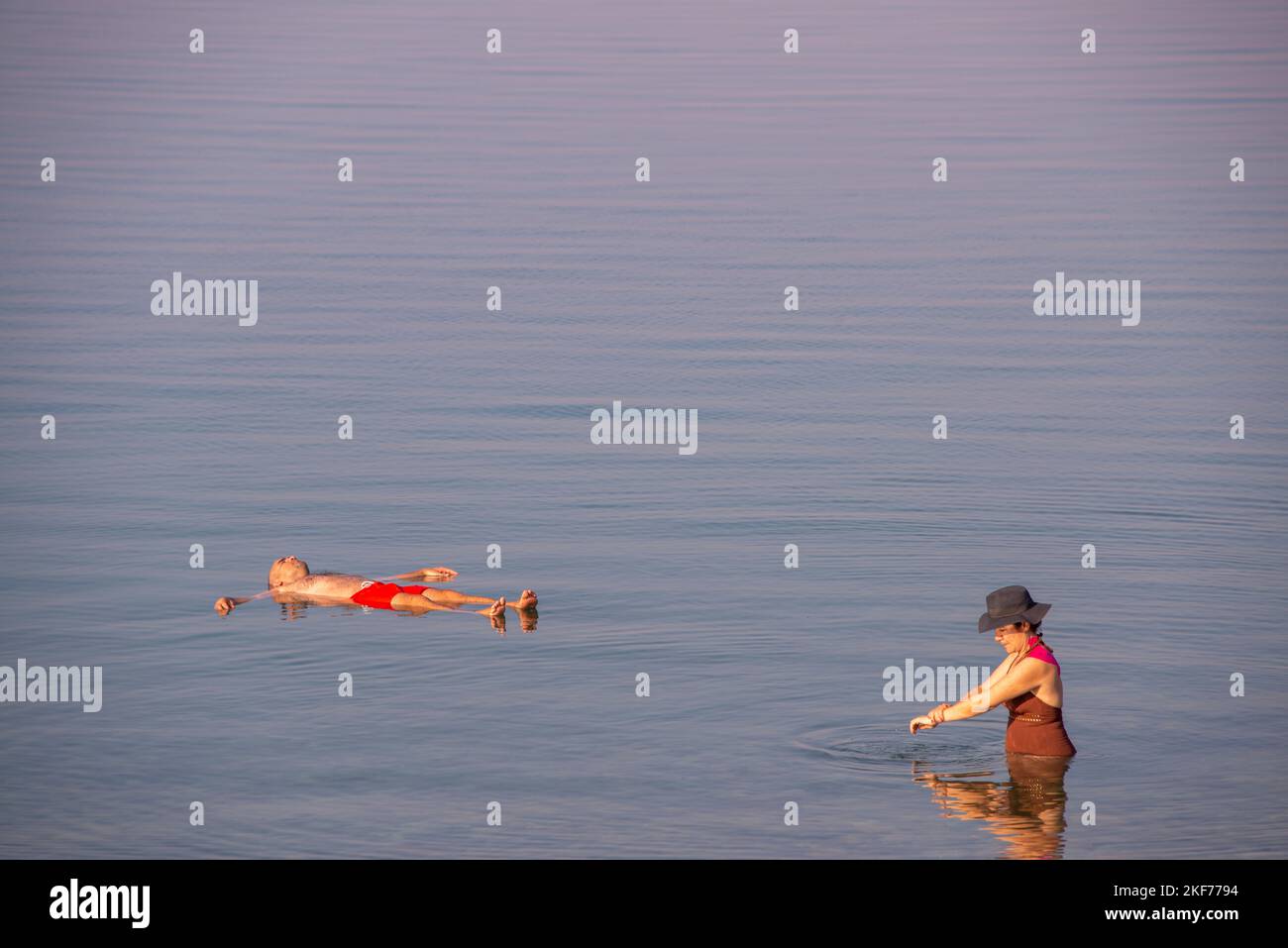 Early morning couple bathing in Dead sea Jordan Stock Photo - Alamy