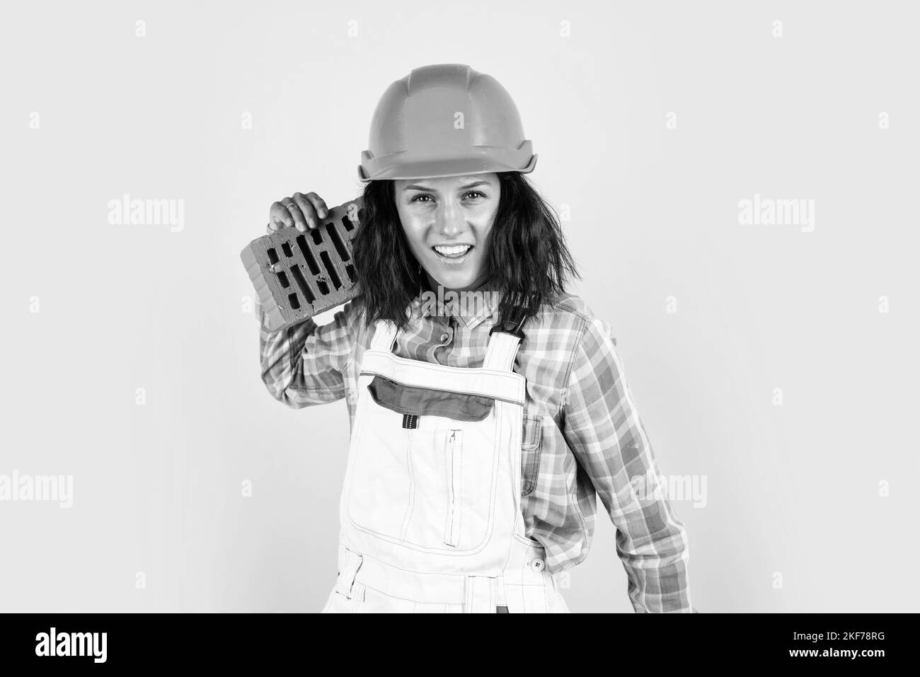 Building tomorrow. girl in workshop uniform. repairing tools used in ...
