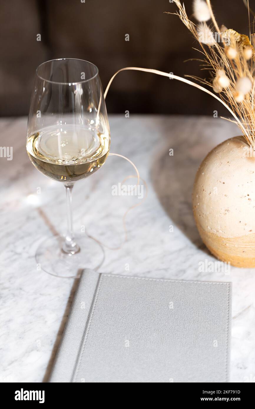 The glass of red, white wine on the table, in woman hand Stock Photo ...