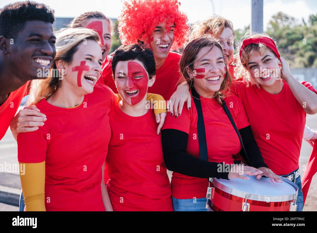 Group of fans celebrating the successes of their team have fun together ...