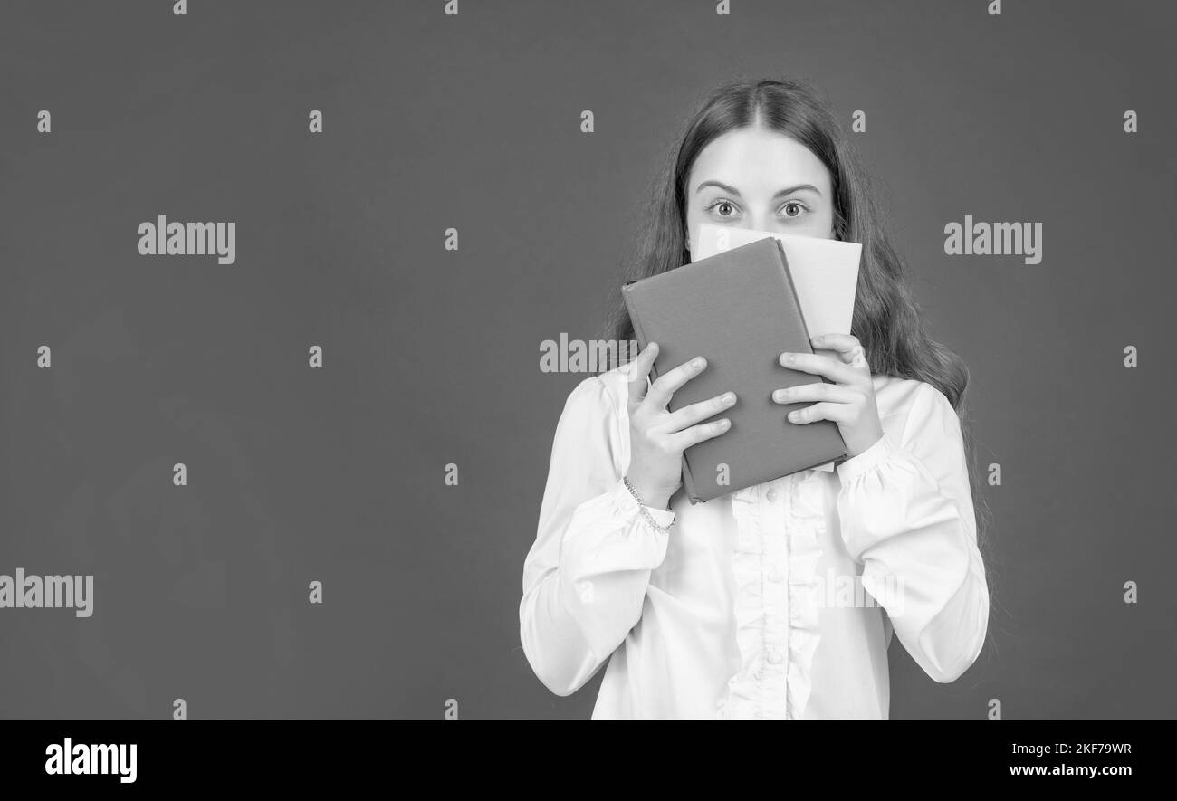 happy childhood. child going to do homework. student behind book Stock ...