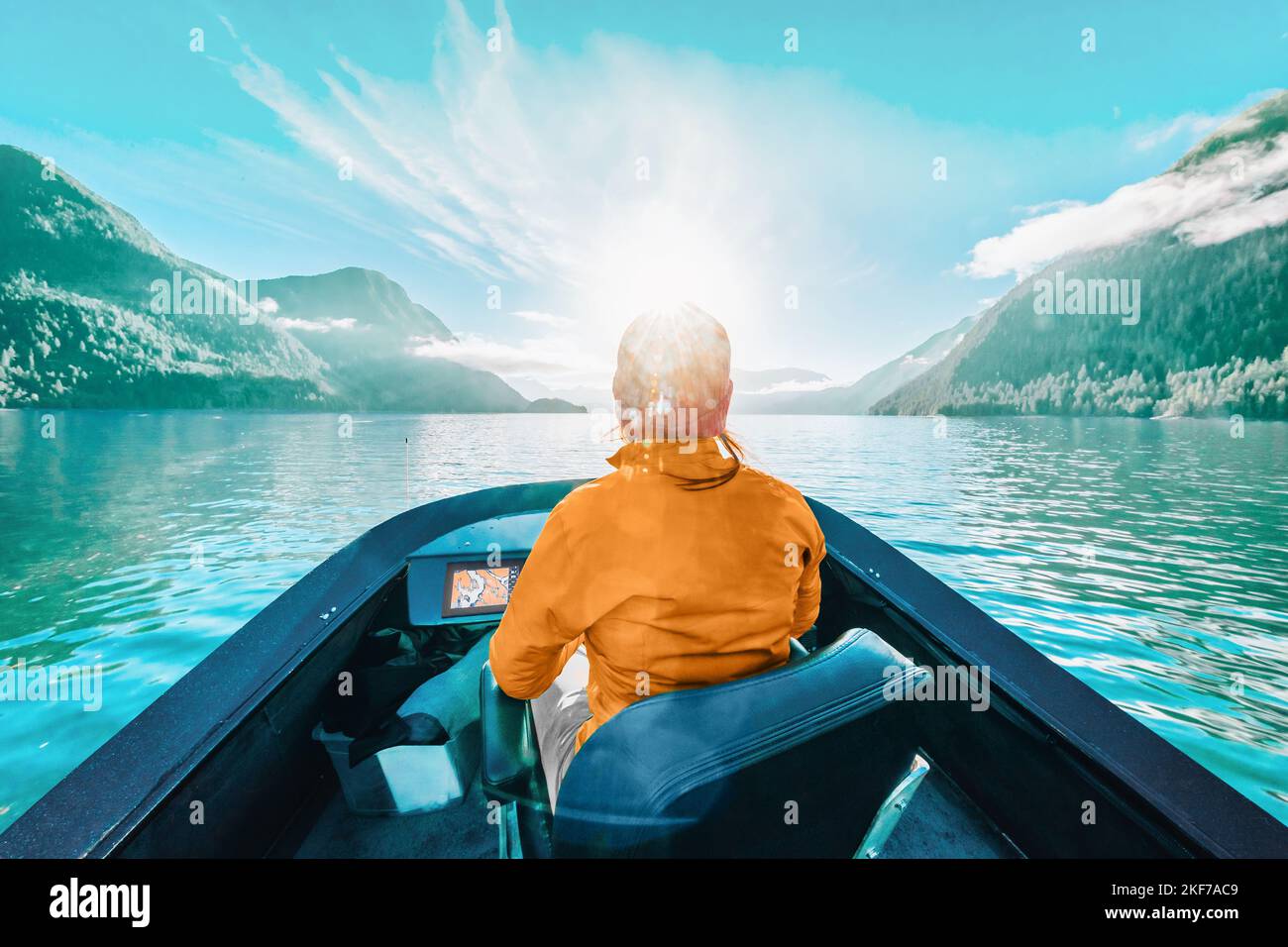 Boat people. Young woman driving motor boat in nature Stock Photo - Alamy