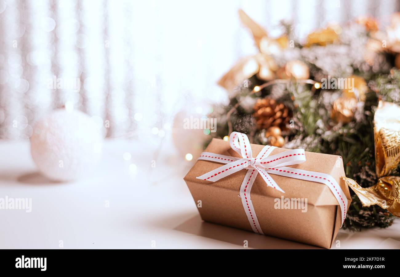 Christmas present wrapped in kraft paper with natural decoration Stock ...