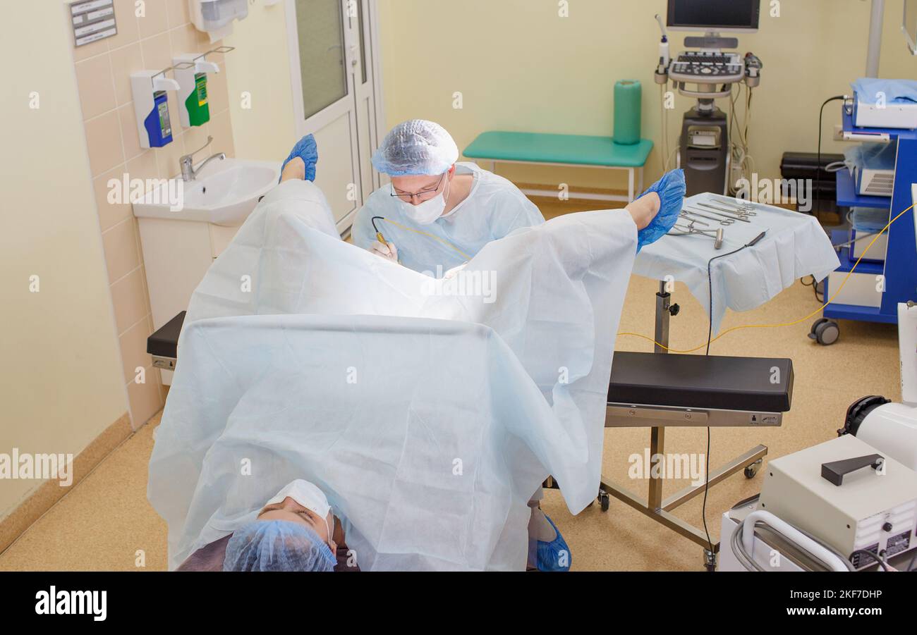 Patient and doctor in hospital during colonoscopy, close-up ...