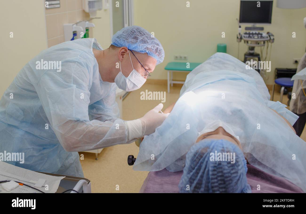 Patient lying on an operating table hi-res stock photography and images ...