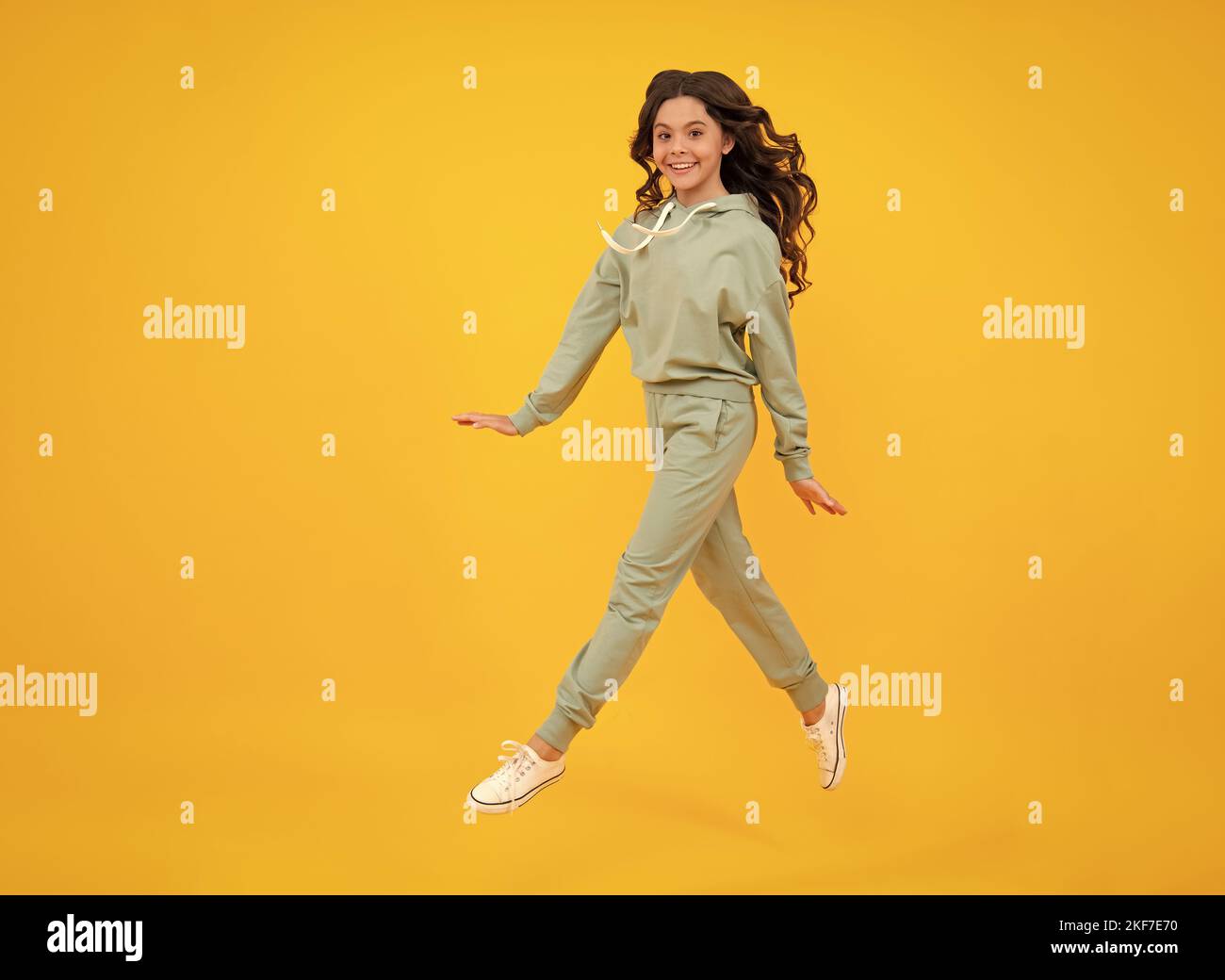 Sporty teenager child wearing a casual sport look. Cute teen girl in ...