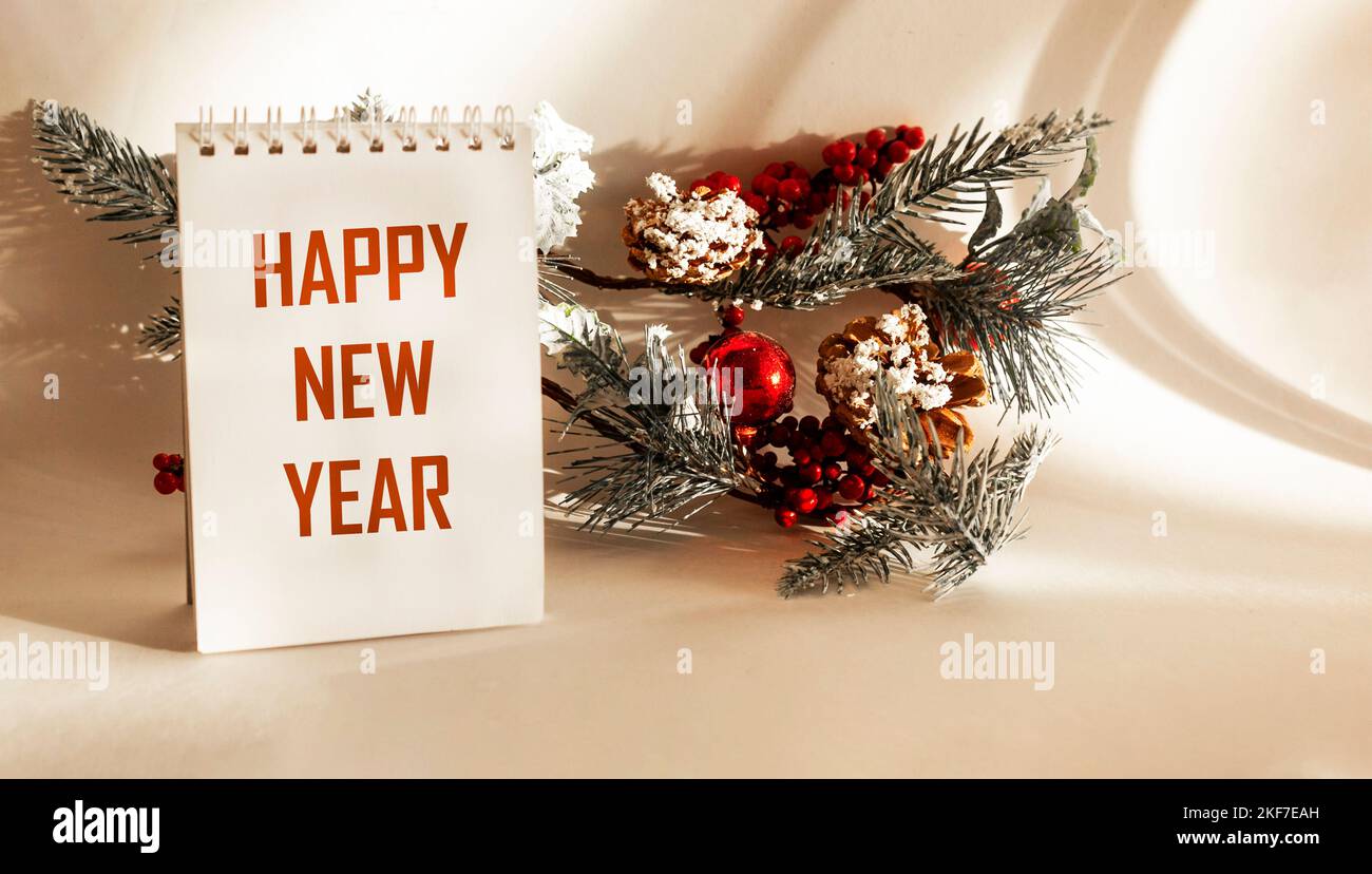 Happy New Year on notepad with New Years Eve decoration, concept image ...