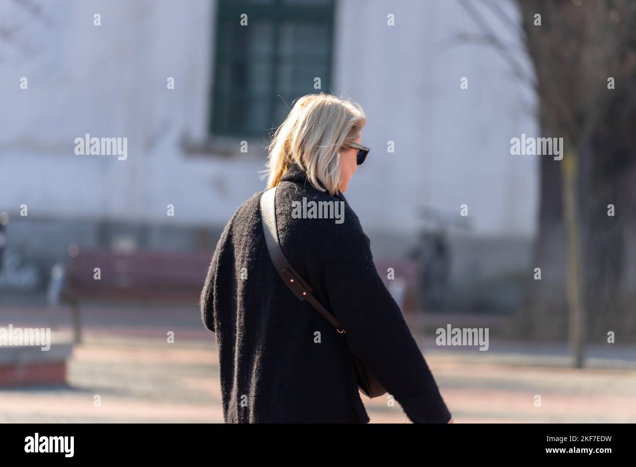 Woman walking on the street. Real people Stock Photo - Alamy
