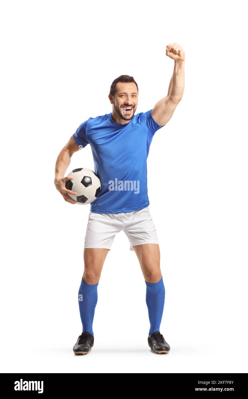 Excited fotball player holding a ball and cheering isolated on white ...