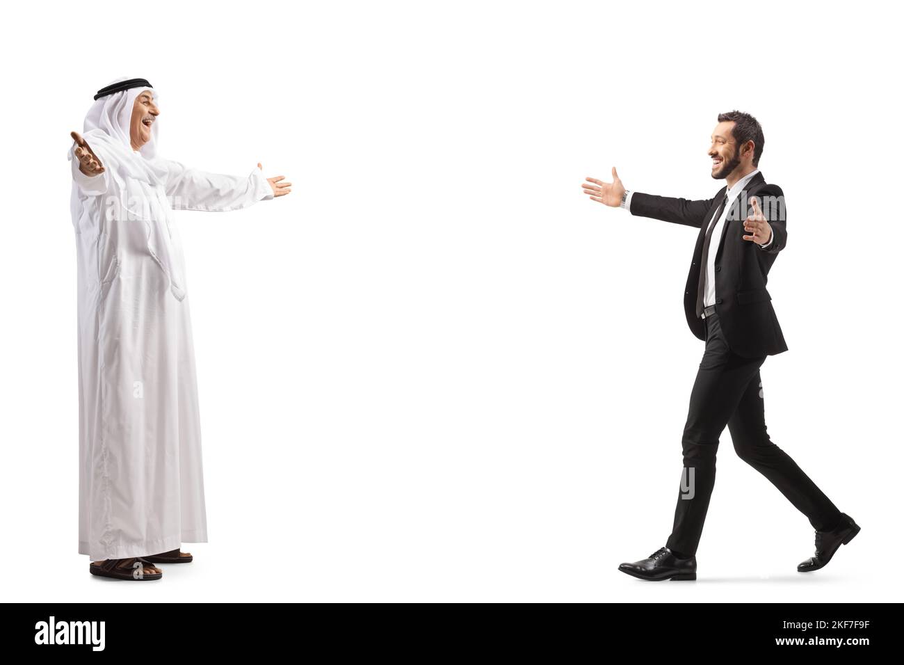 Full length profile shot of a mature arab man in a robe meeting a ...