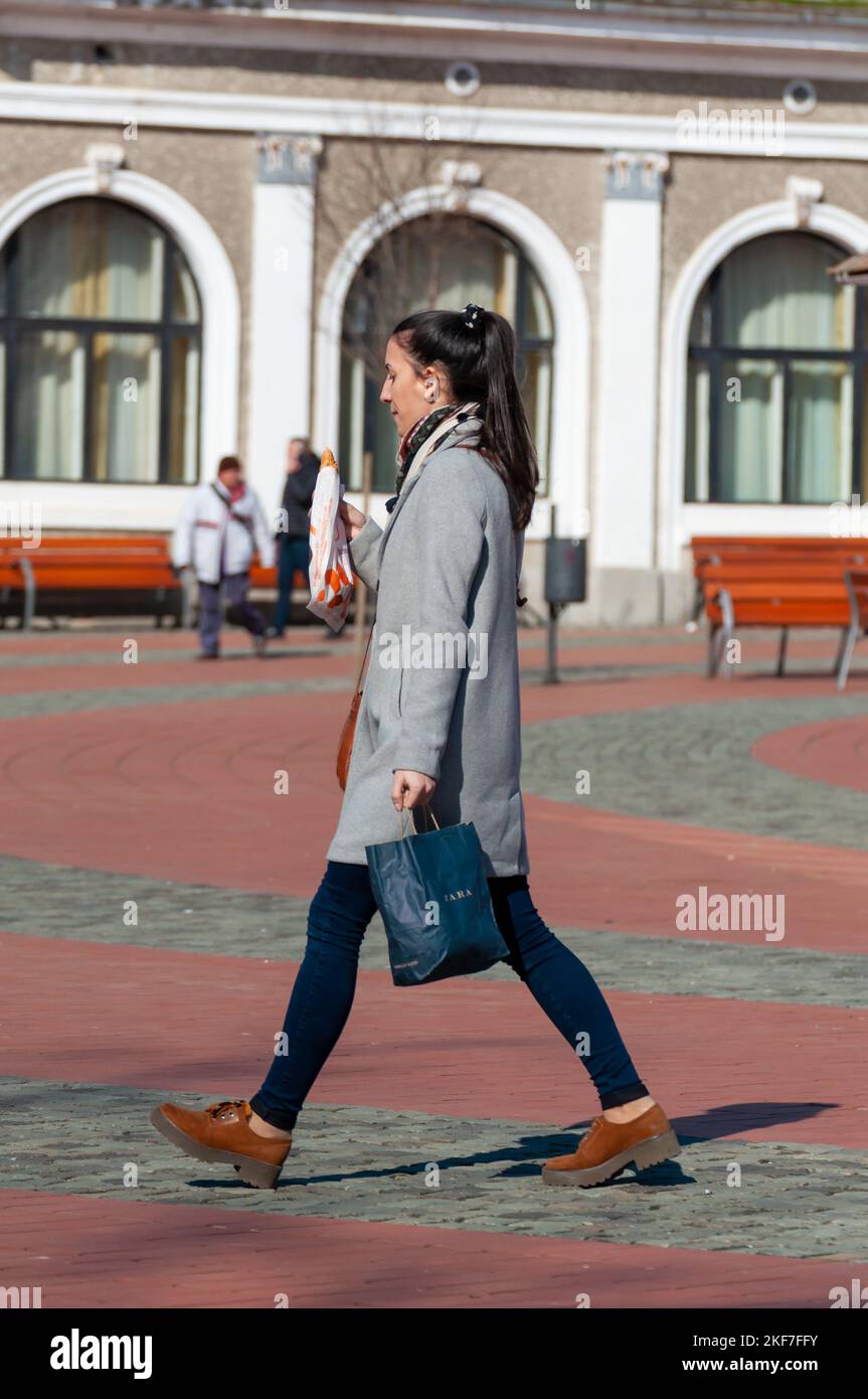 Timisoara, Romania - March 15, 2018: Woman walking on the street. Real ...