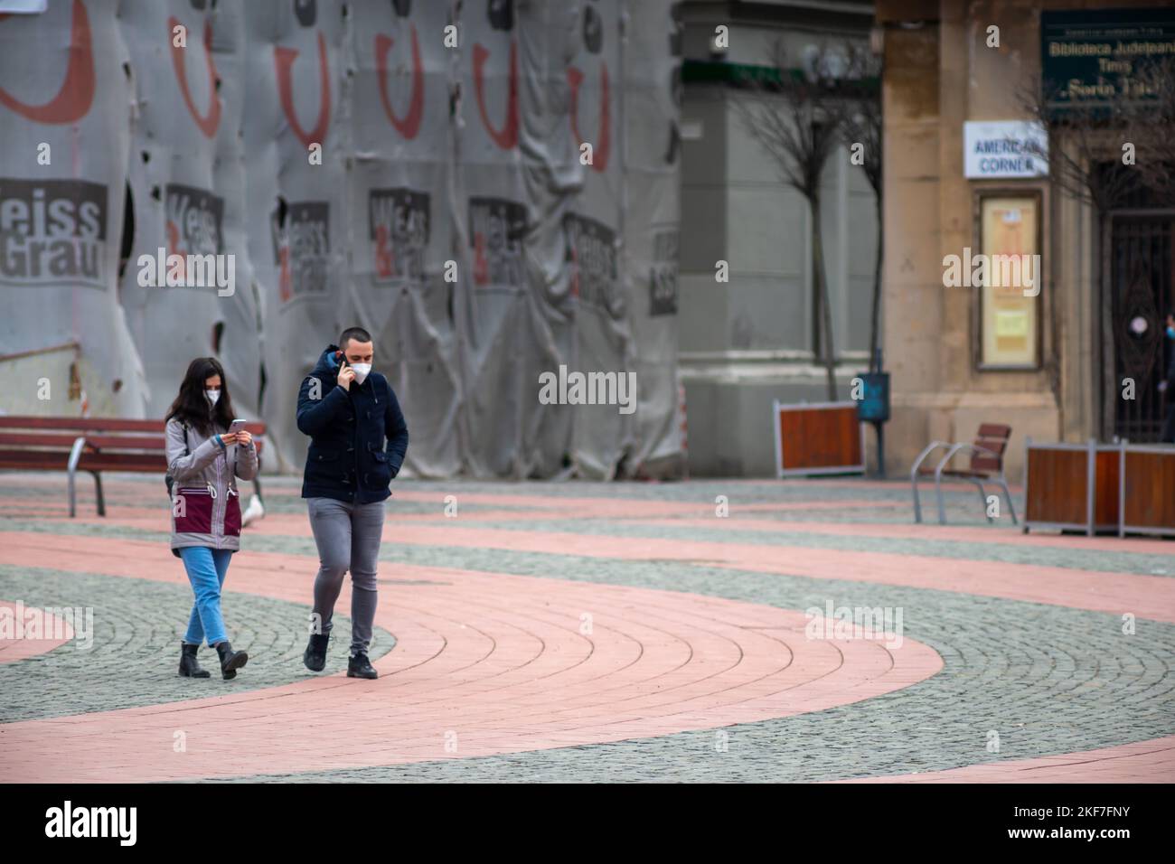 Timisoara, Romania - April 4, 2021: People walking on the street. Real ...