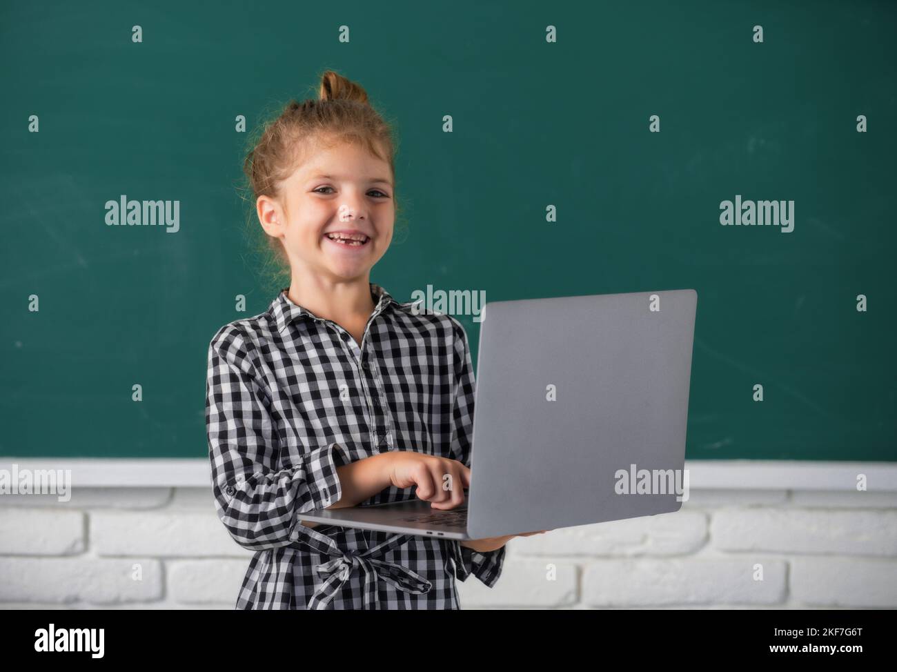 Child girl using gadgets to study. Computer education for kids Stock ...