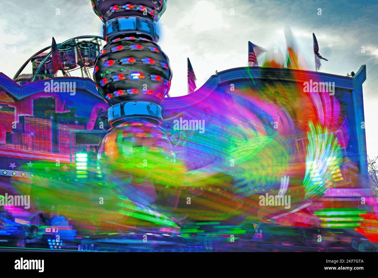 Long exposure of a carnival ride in fast motion at a Christmas fair ...