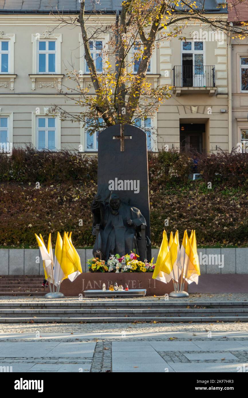 The monument shows the Pope, John Paul II, sitting on a big chair and ...