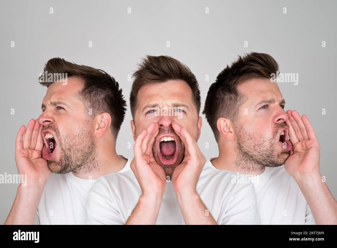 Handsome happy man shouting loudly, isolated on grey background Stock ...