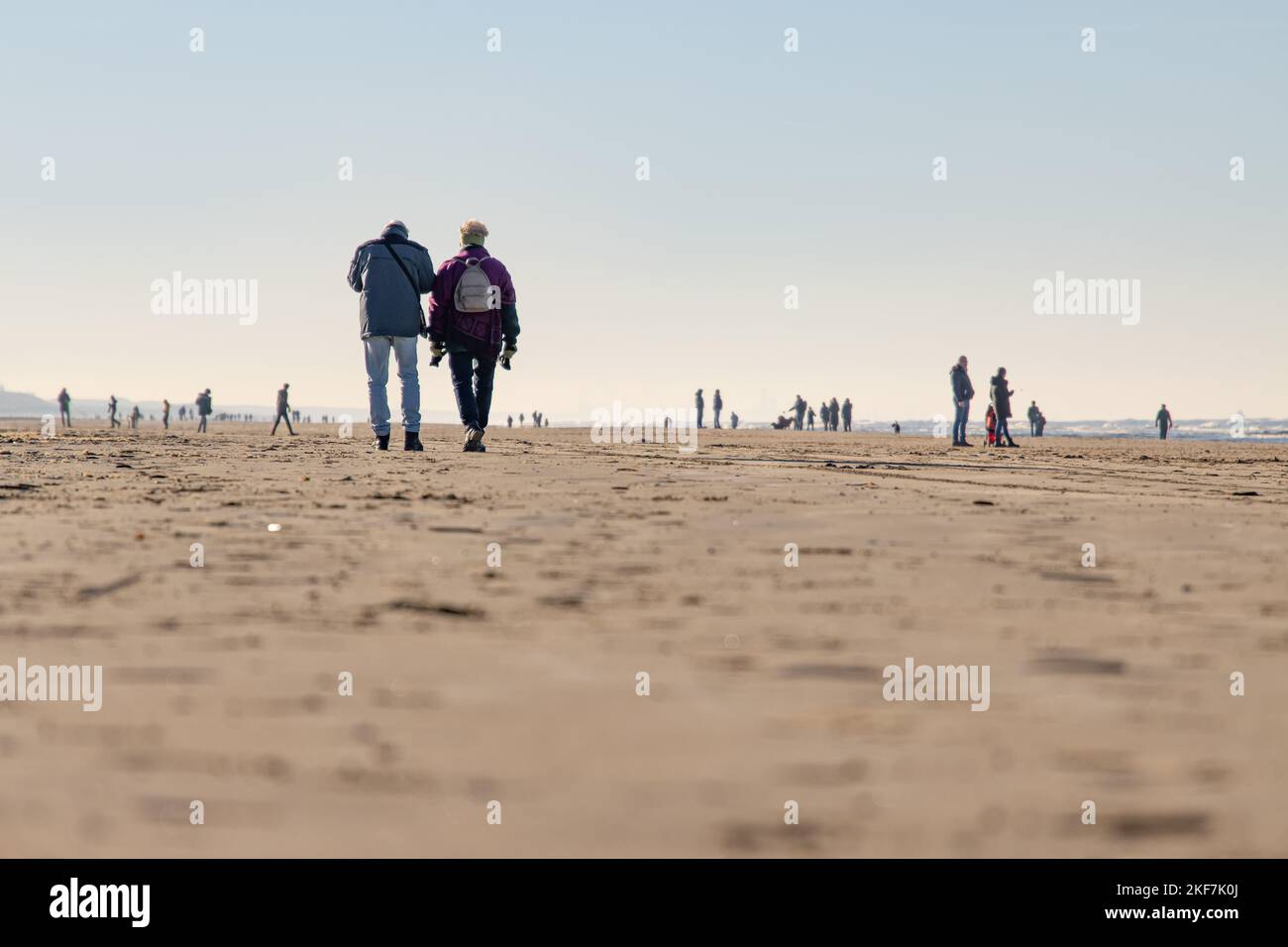 People walking on the beach in the winter at Noordwijk aan Zee Stock ...