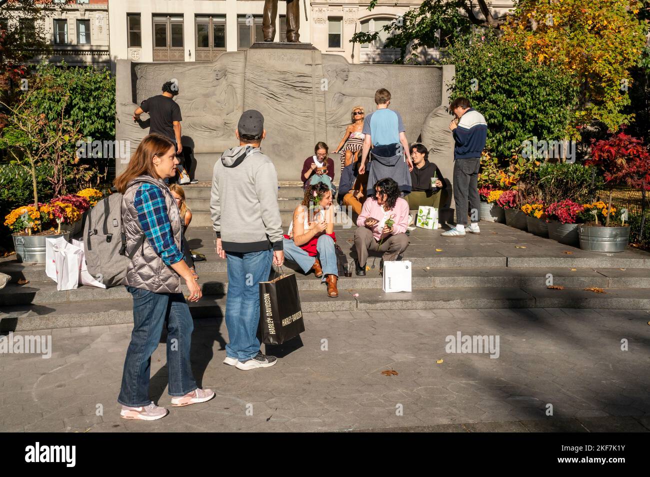 Visitors enjoy the warm weather at the Farragut Monument in Madison ...