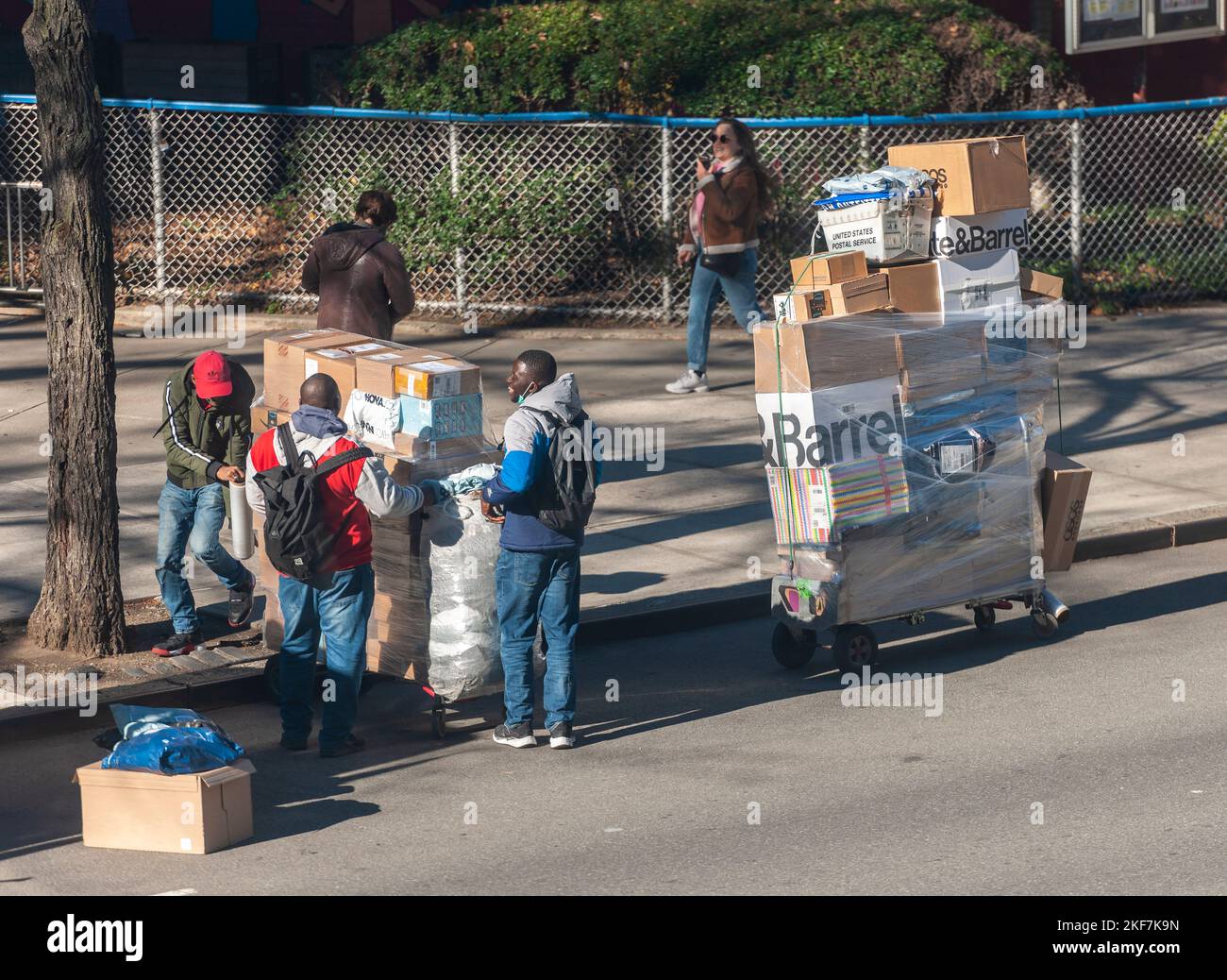 Workers prepare Amazon deliveries for distribution in the Chelsea ...