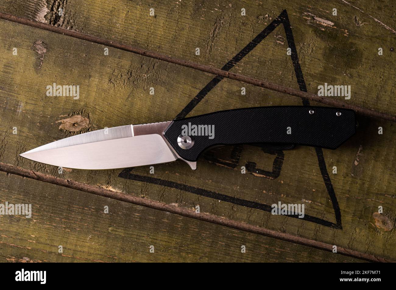 A sharp knife with a false sharpening on the blade. Knife with a black ...