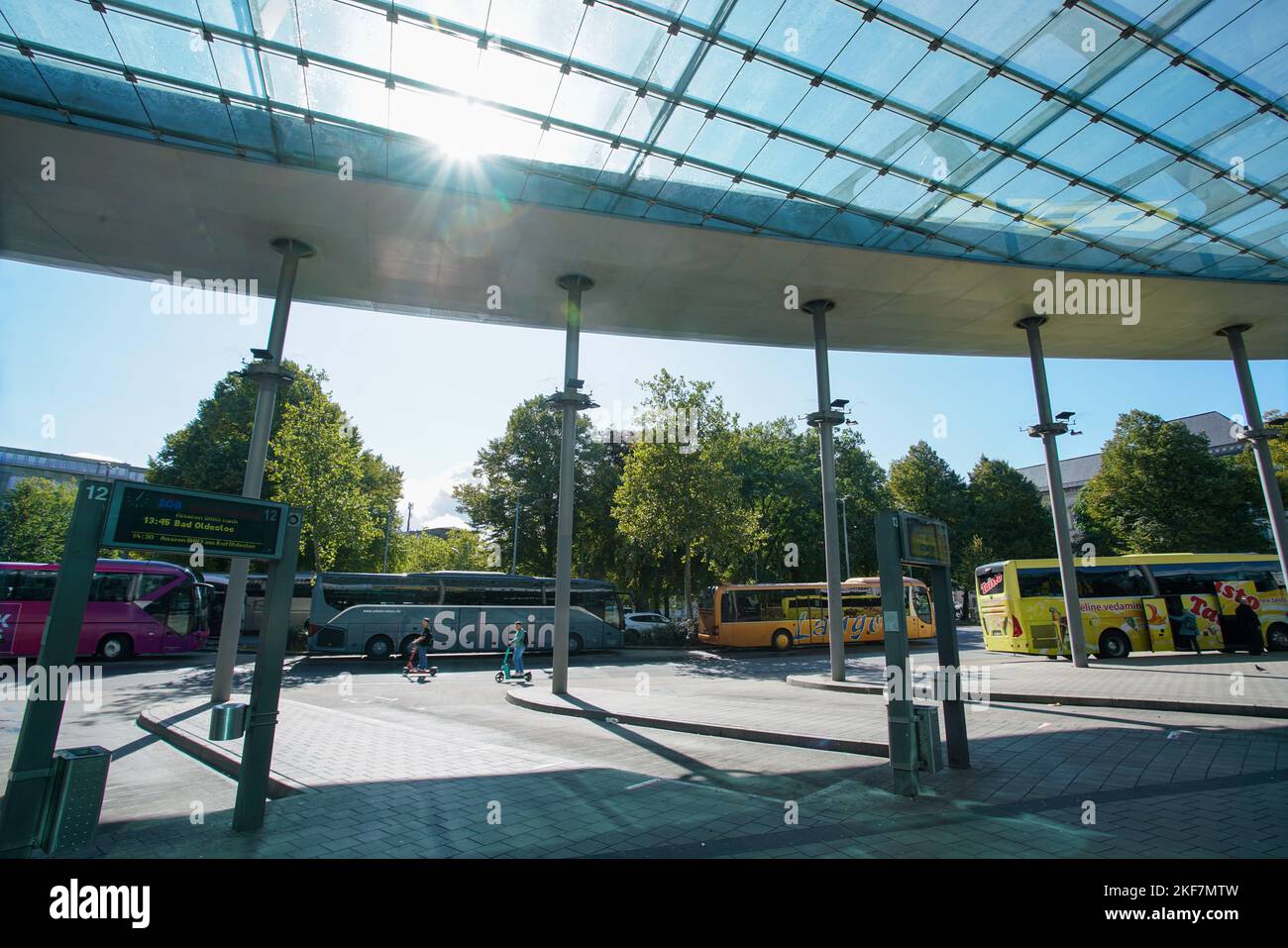09-15-2022 Bus station with glass roof in Hamburg. Buses of different ...